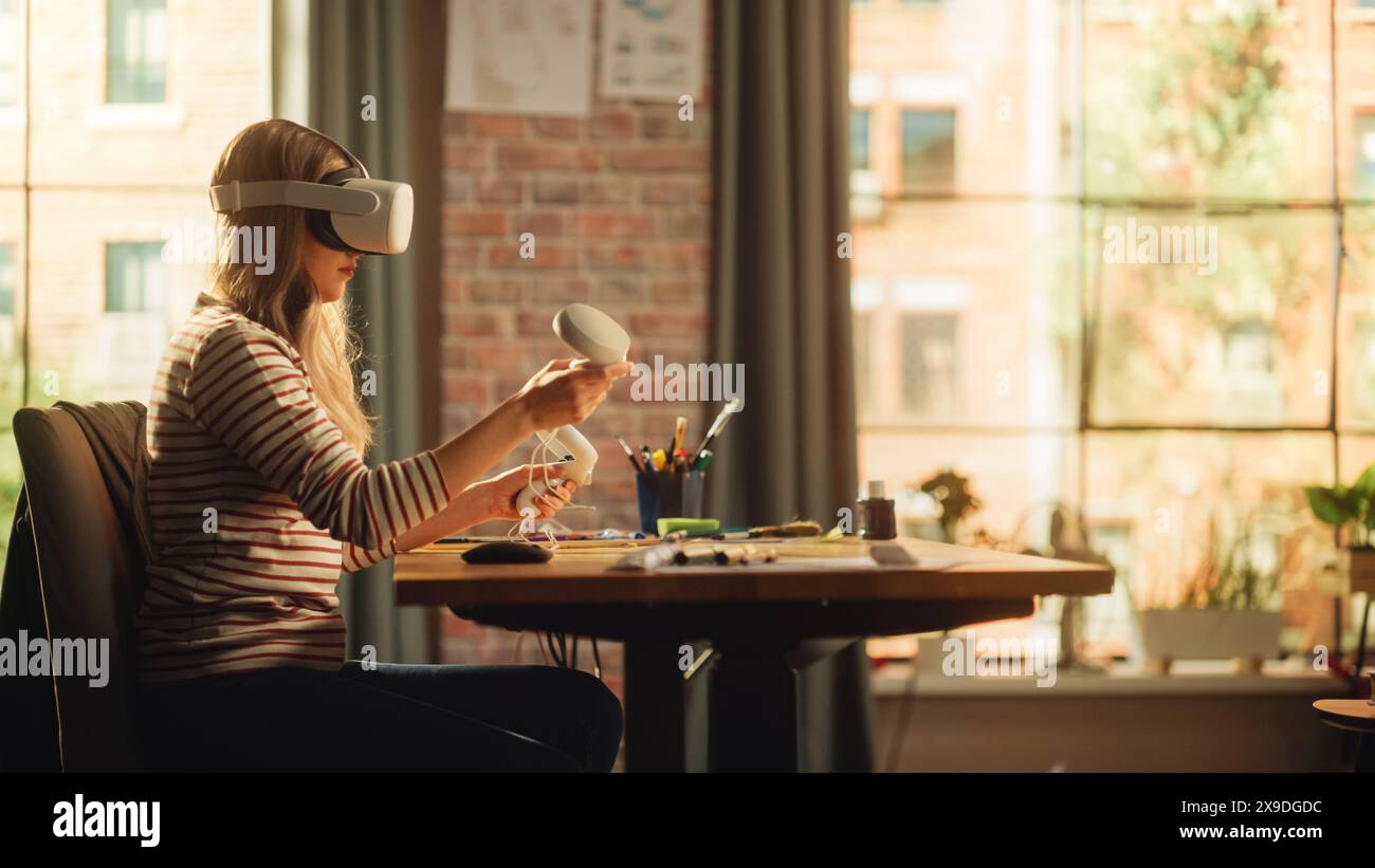 Blonde Woman Wearing 3D VR Headset And Using Modern Controllers in Loft ...