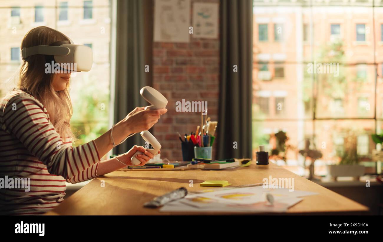 Blonde Woman Wearing 3D VR Headset And Using Modern Controllers in Loft ...