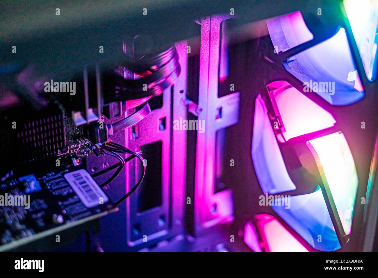 Close-up of a computer case interior with RGB lighting and visible ...