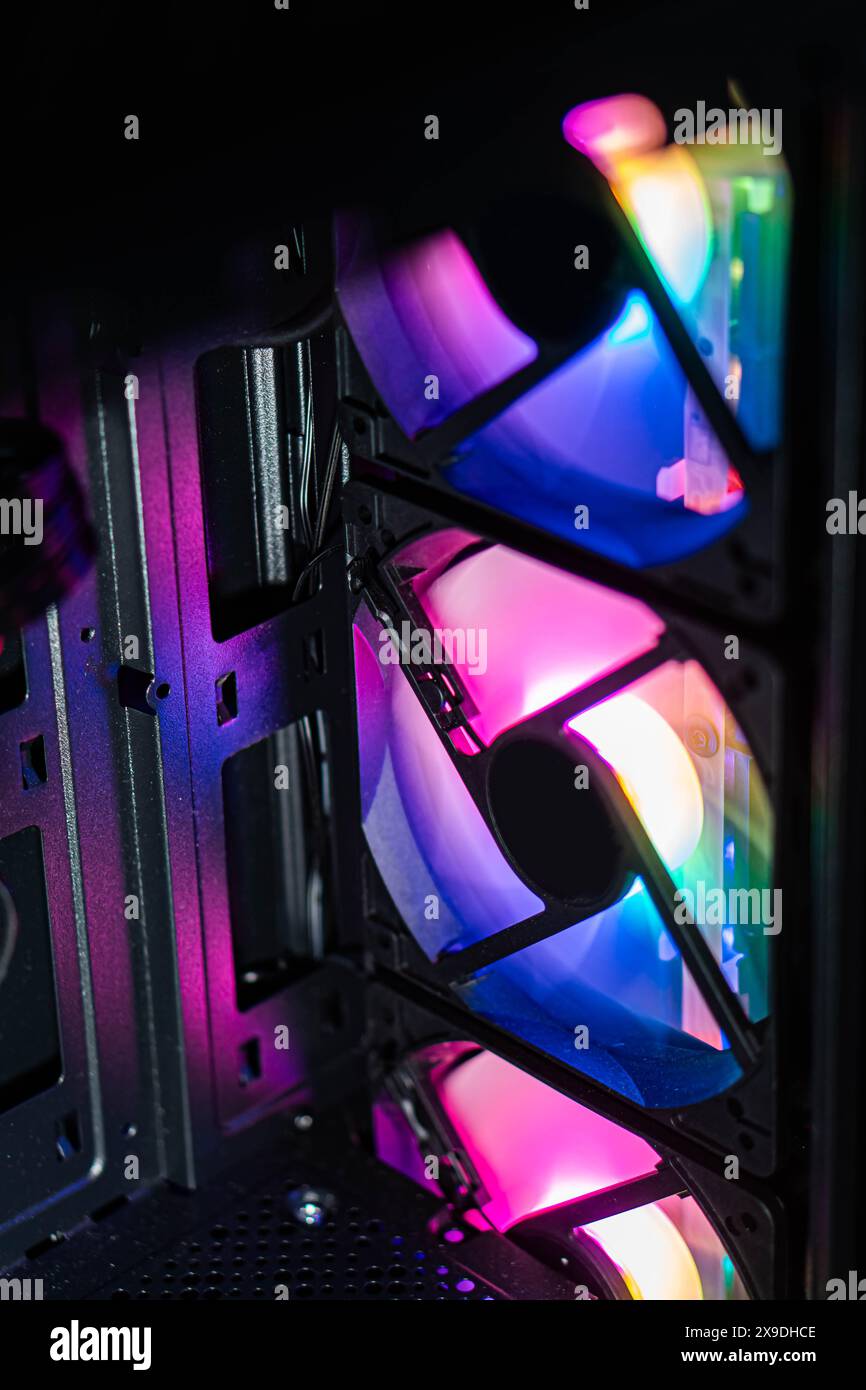Close-up of RGB LED fans inside a computer case, illuminating the ...