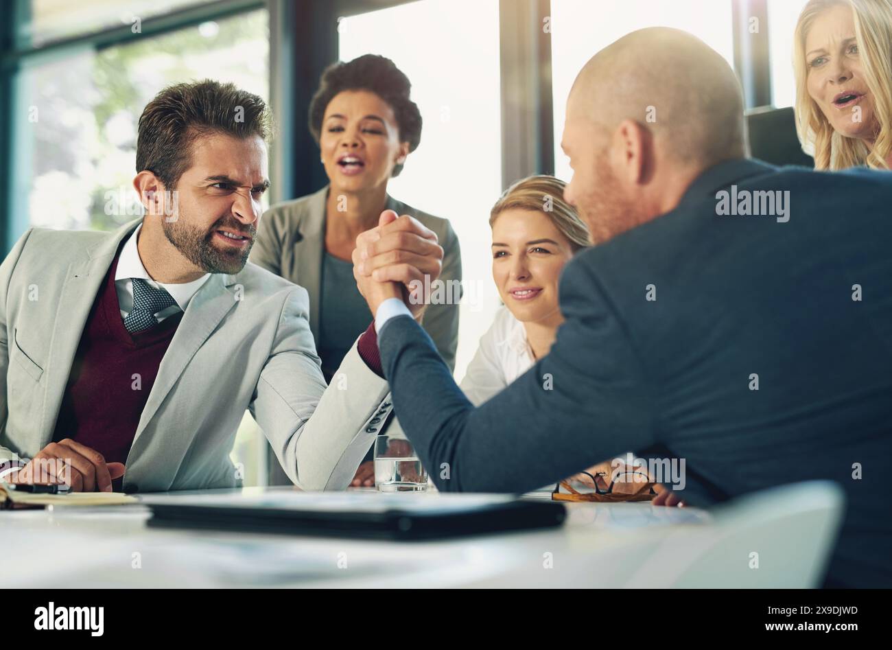 Serious, businessmen and arm wrestle in office for corporate challenge ...