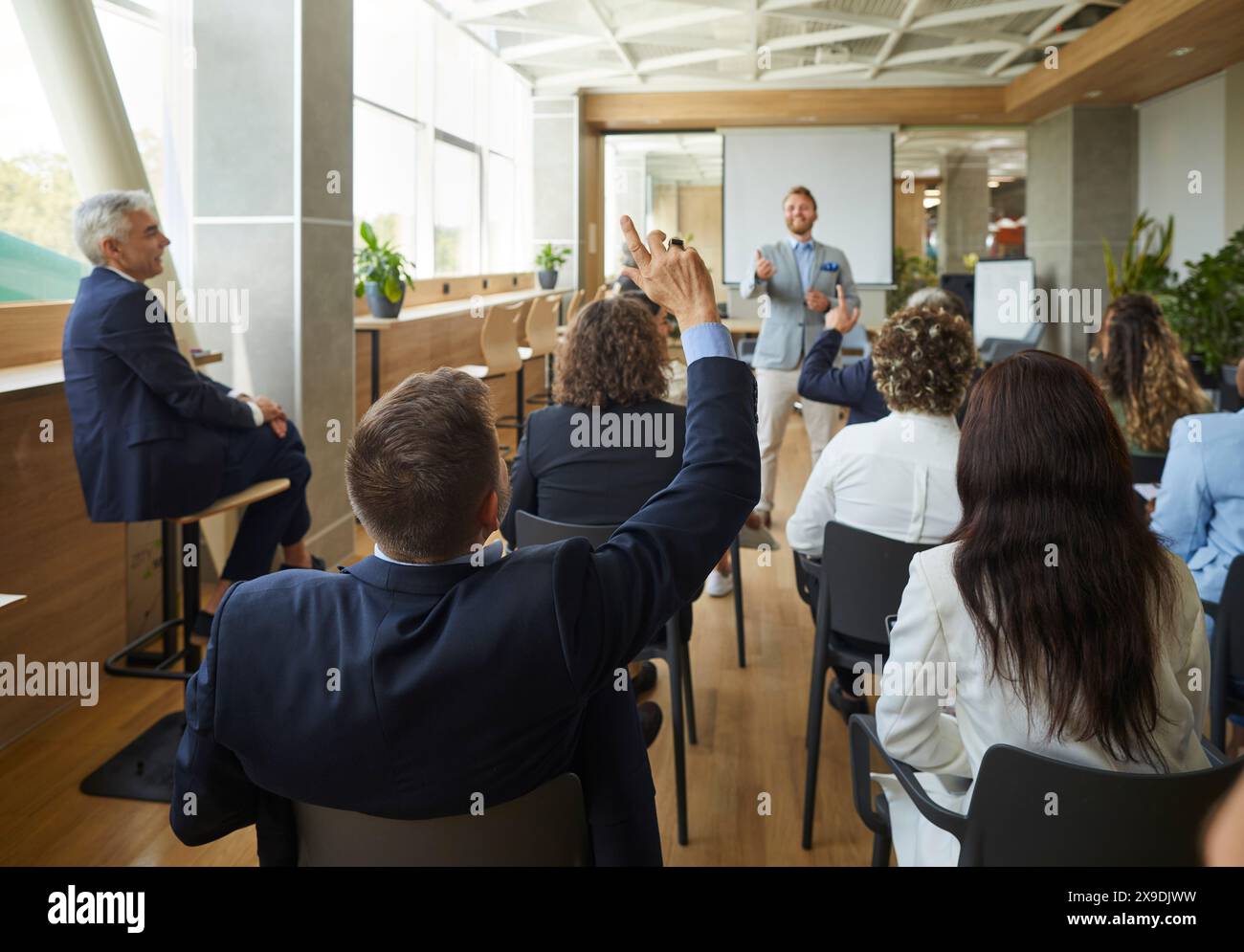 People colleagues raising hands to ask questions during business ...