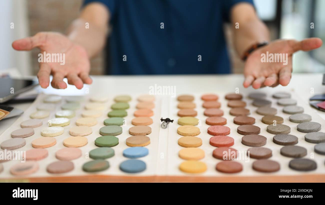 Anonymous Interior designer showing color swatch for creating project ...