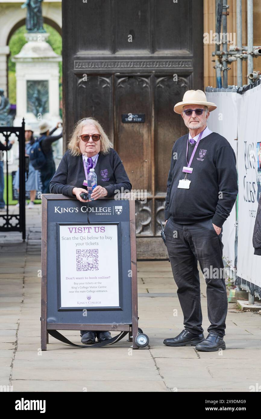 A couple of security guards at the entrance to King's College ...