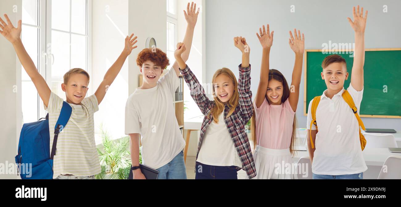 Happy school children, pre-teens, teenagers in expression of greeting ...