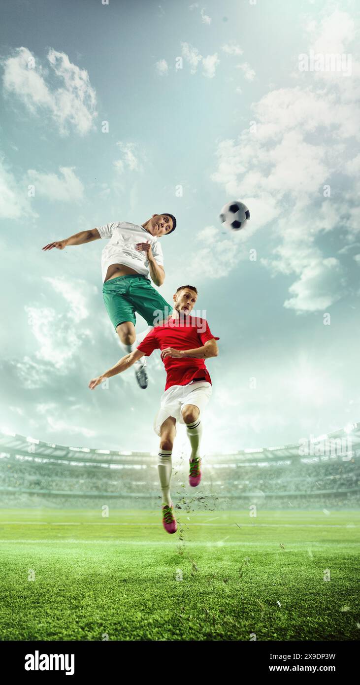 Dynamic image of two soccer players in mid-air, competing to head ...