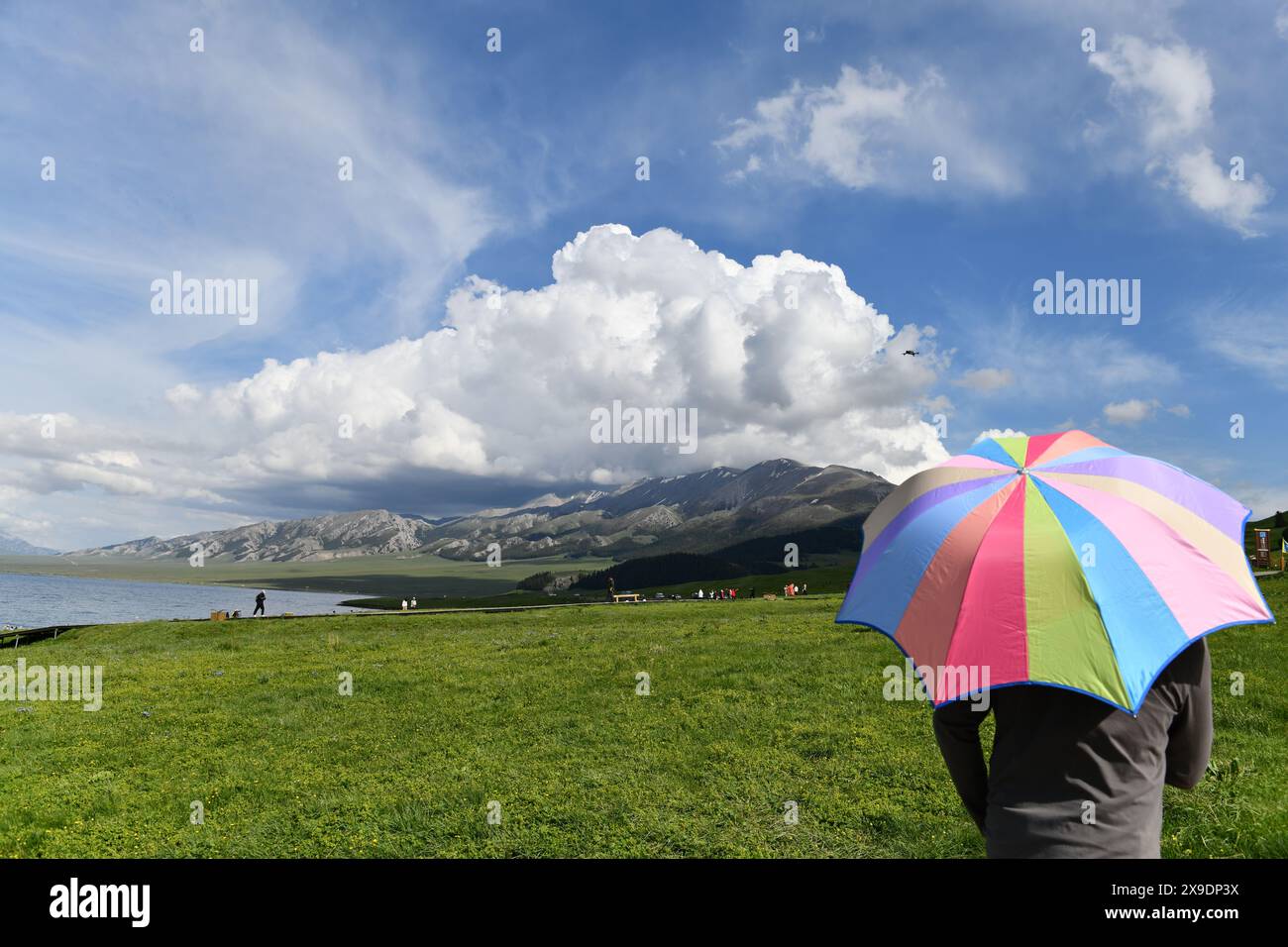 Bole, China. 31st May, 2024. Tourists are visiting the Sayram Lake ...