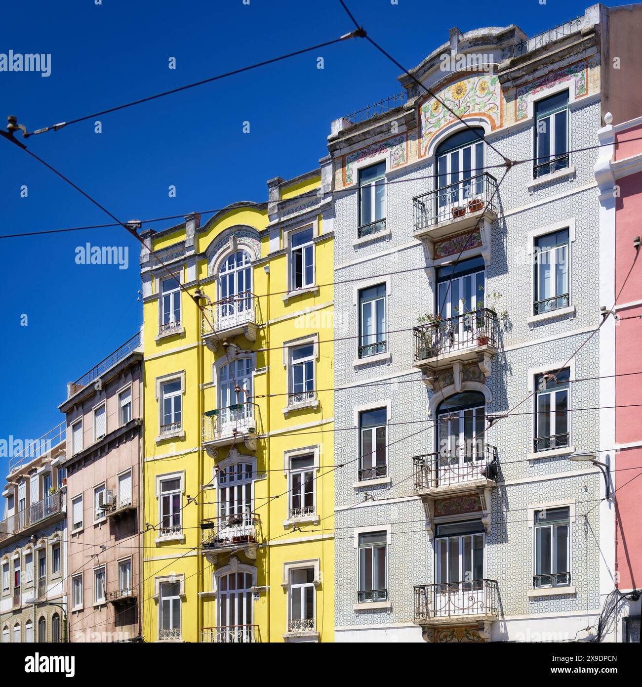 pastel-coloured and typically tiled residential buildings with the ...