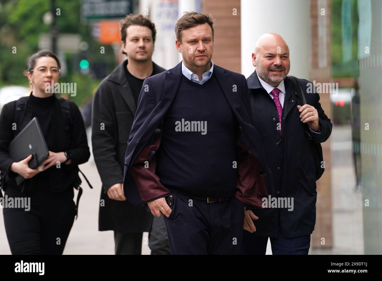 Scott Law, 43, (third from left) arrives at Highbury Corner Magistrates ...