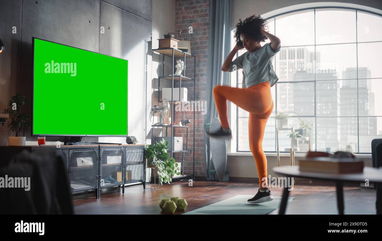 Home Gym: Gorgeous Positive Black Girl Training with Using Green Mock ...