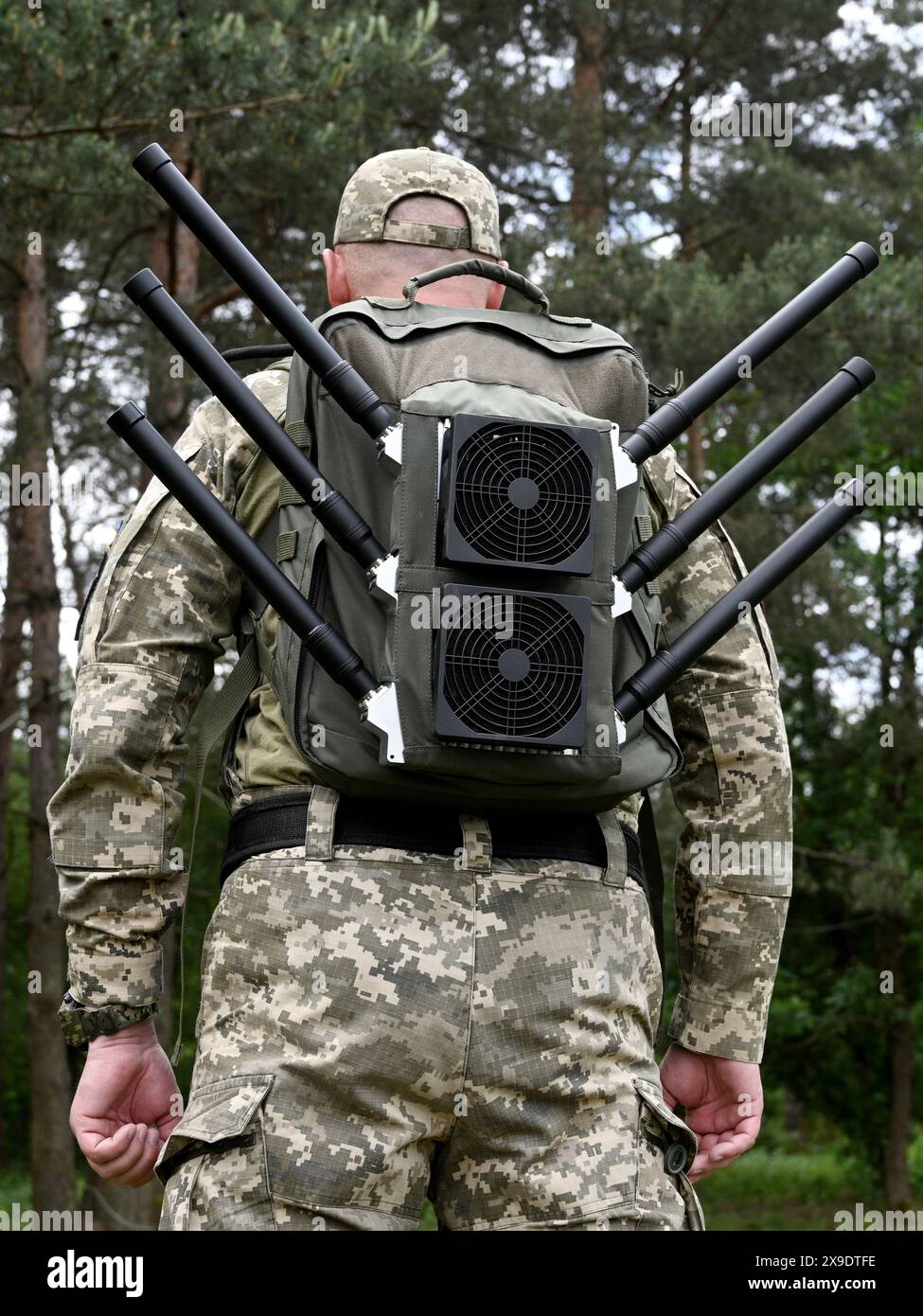 Ukrainian military with anti-drone backpack. WB, radio-electronic ...