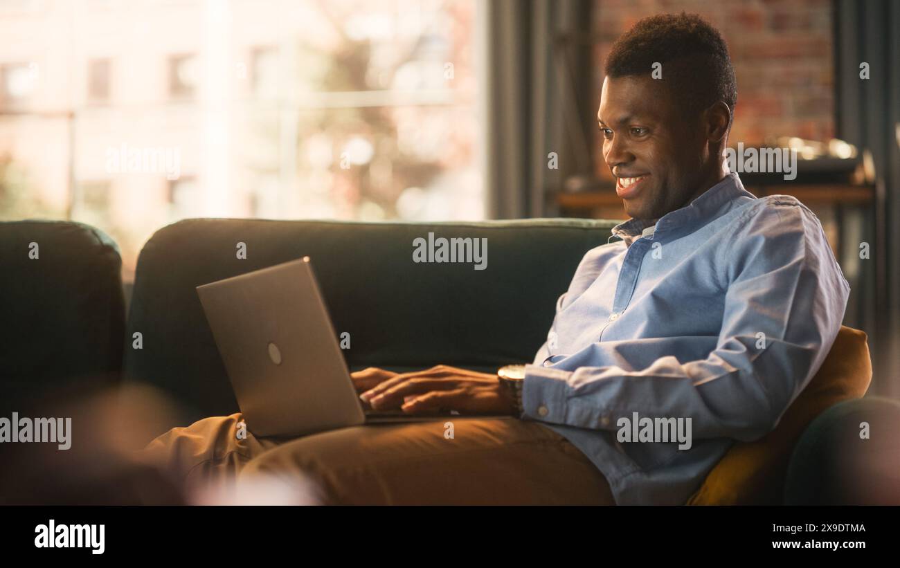 Concentrated Black Male Working From Home, Uses Laptop Computer ...