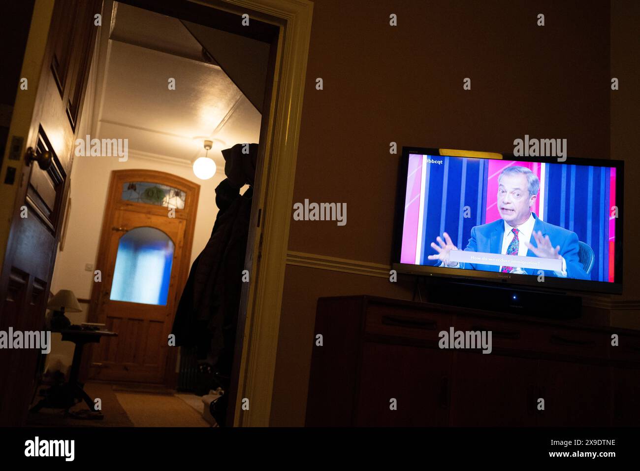 Nigel Farage is seen on a residential home's TV screen during the live ...