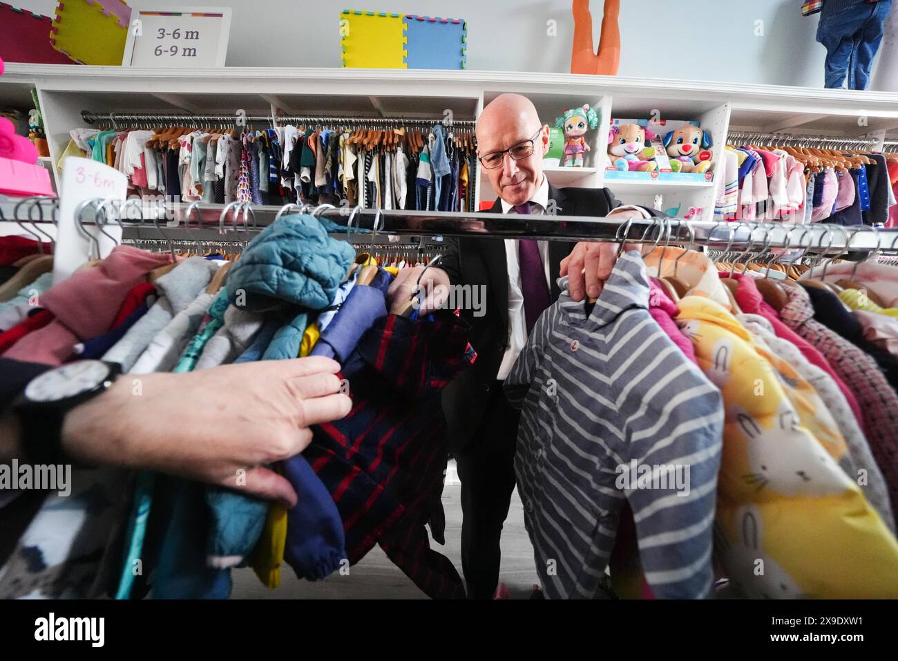 Scottish National Party leader John Swinney looks around the ...