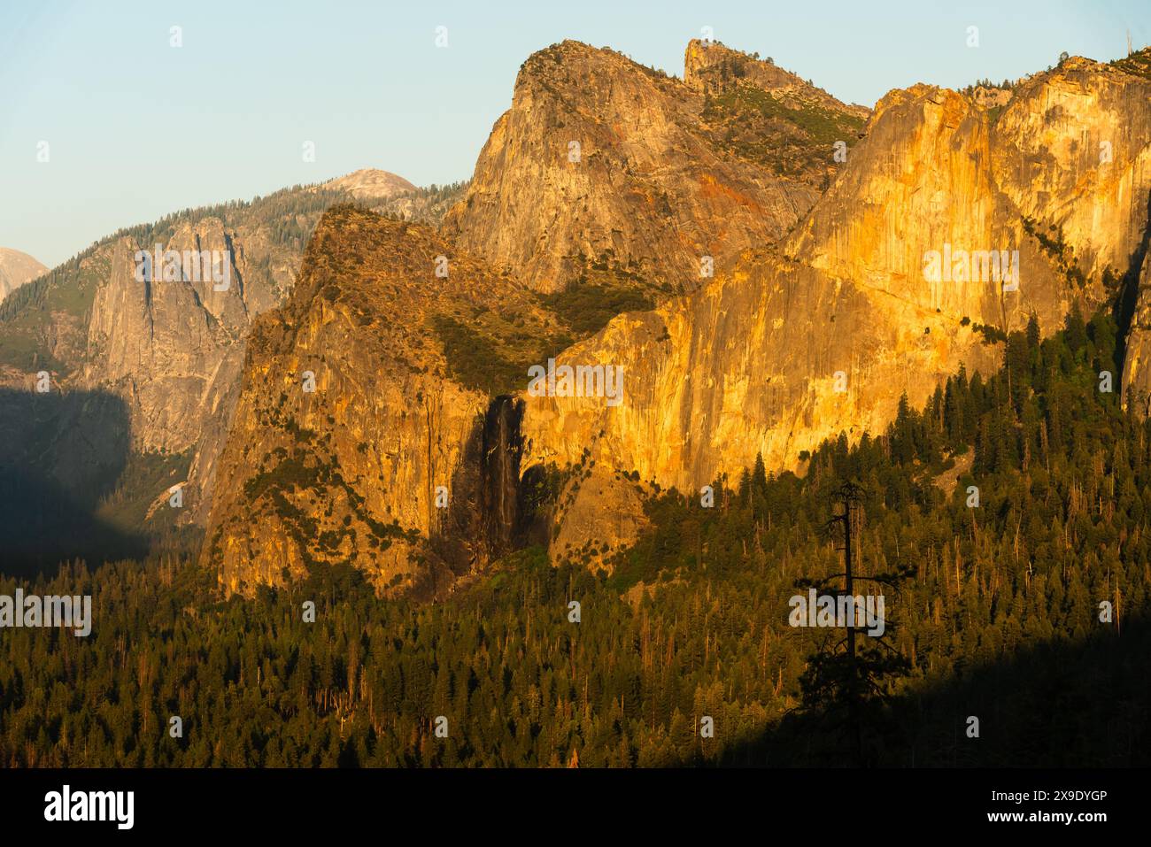 Yosemite Valley at sunlight falling on three brothers Stock Photo - Alamy