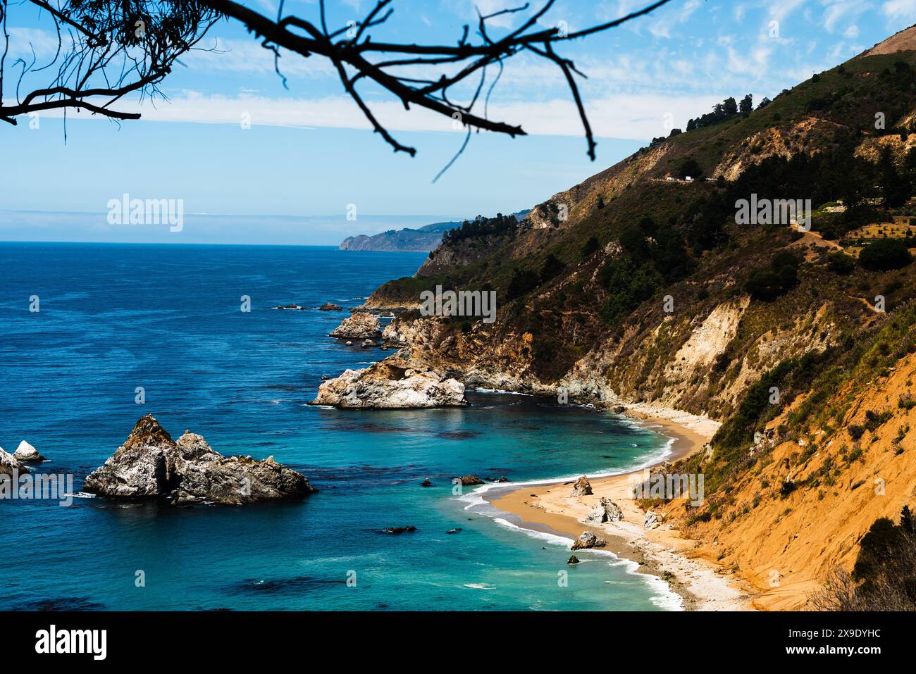 view of Monterey Bay coastline with turquoise waters and rocky cliffs ...