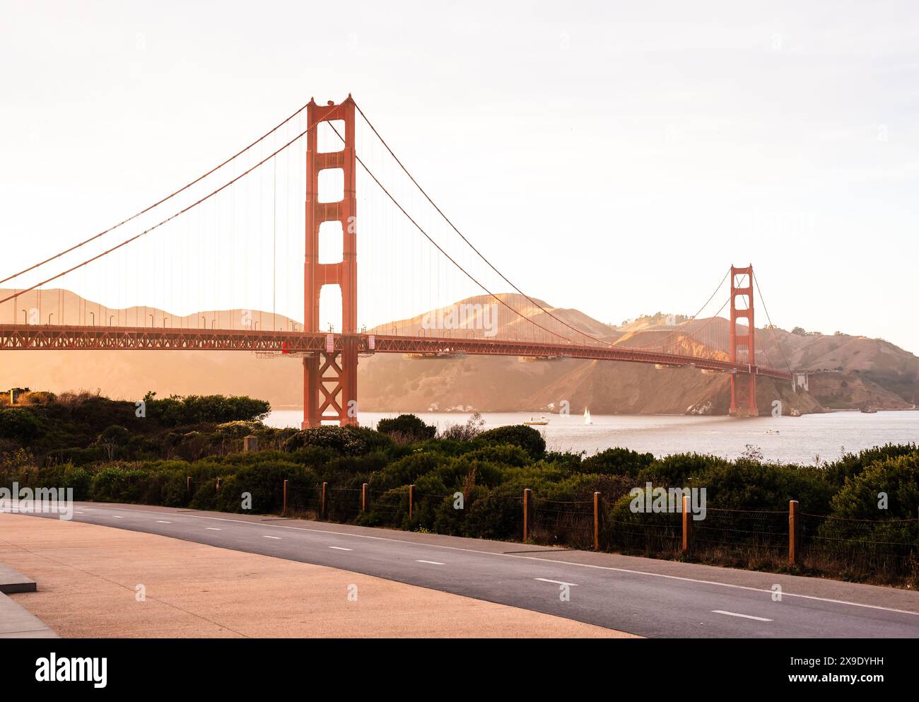 Golden Gate Bridge at sunset with bay and hills in the background Stock ...