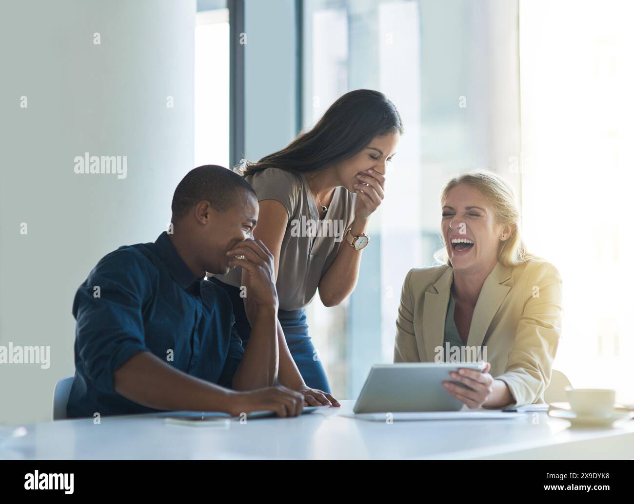 Business people, tablet and laughing in office together for partnership ...