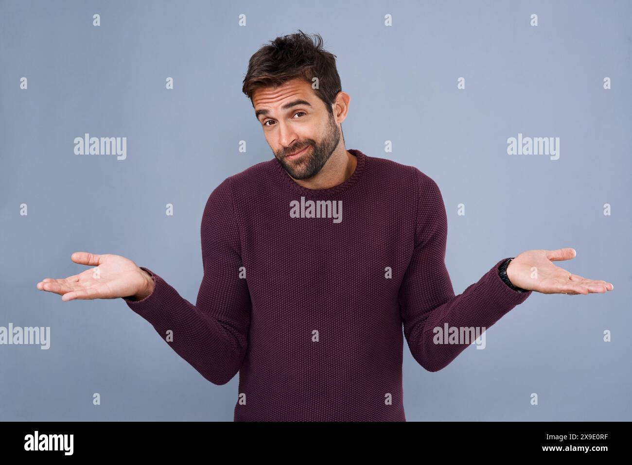 Smile, portrait and man in studio, question and confused with hands ...