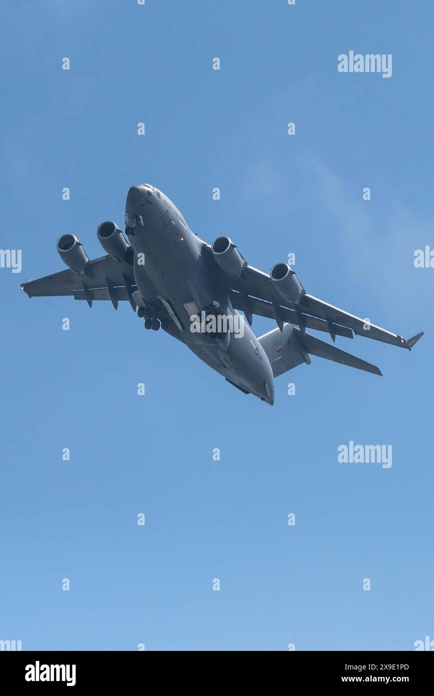 A Royal Air Force RAF McDonnell Douglas/Boeing C17 Globemaster III flying overhead with its ...