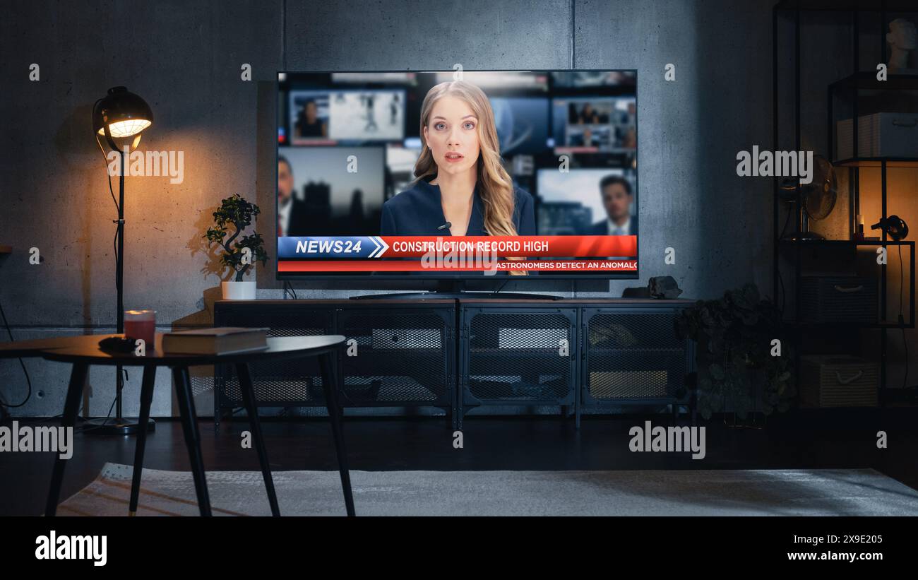 Stylish Loft Apartment Interior with TV Set with Evening News Show on ...