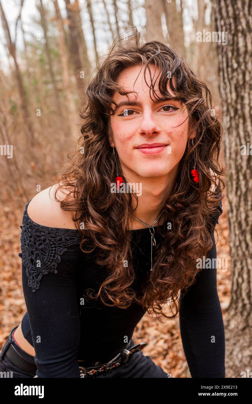 androgynous teen posing in the woods Stock Photo - Alamy