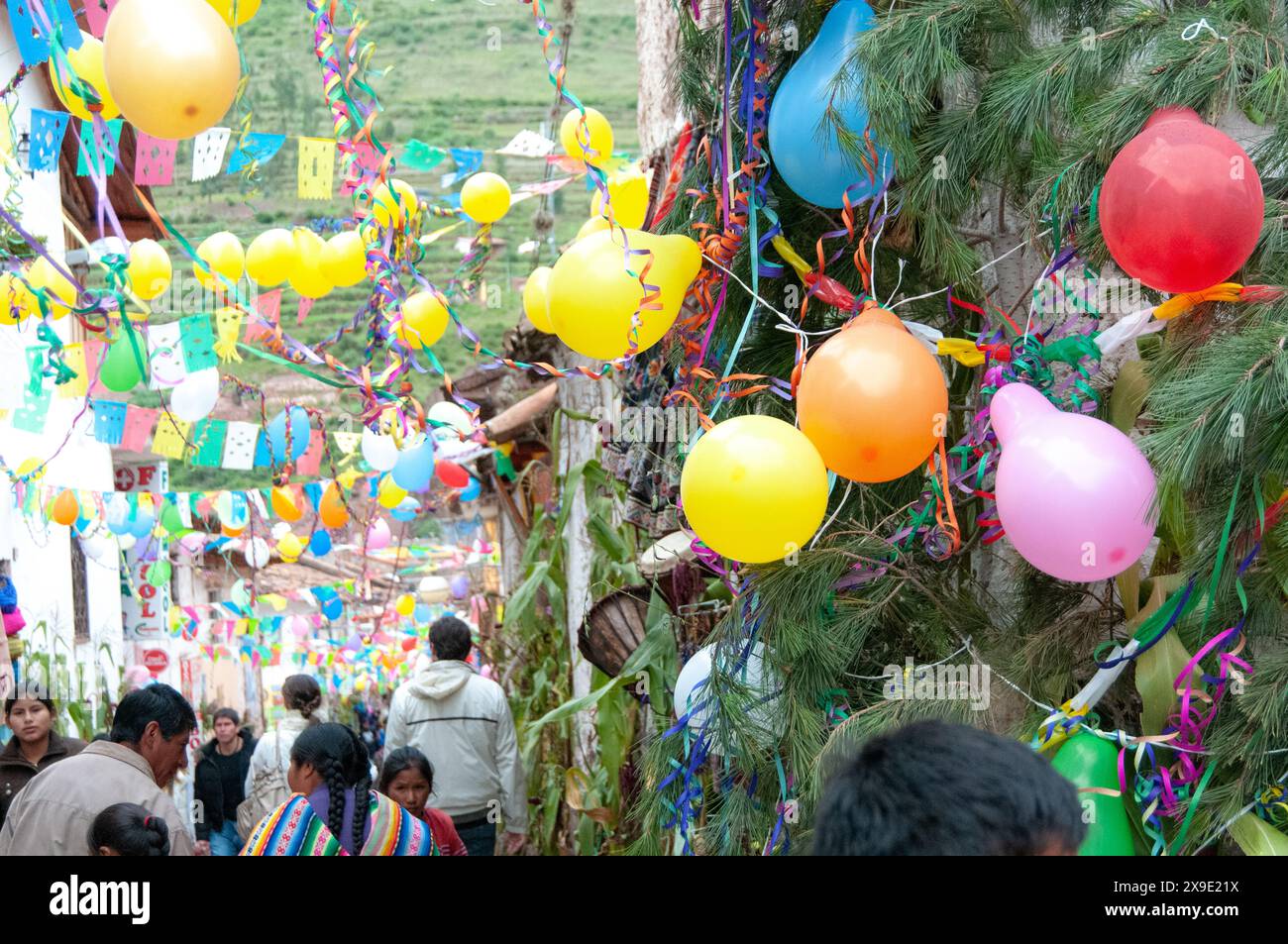 Vibrant street festival with balloons and streamers in rural vil Stock ...