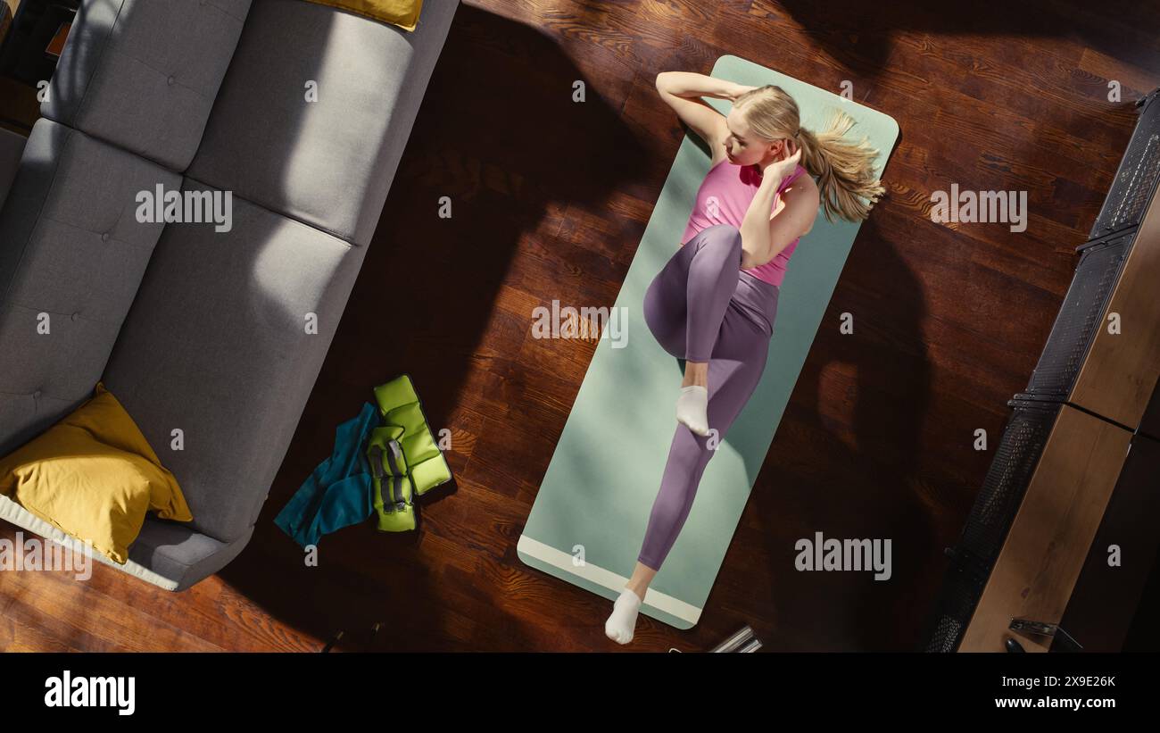 Top View Sport: Gorgeous Girl Doing ABS Elbow to Knee Crunches Lying on ...