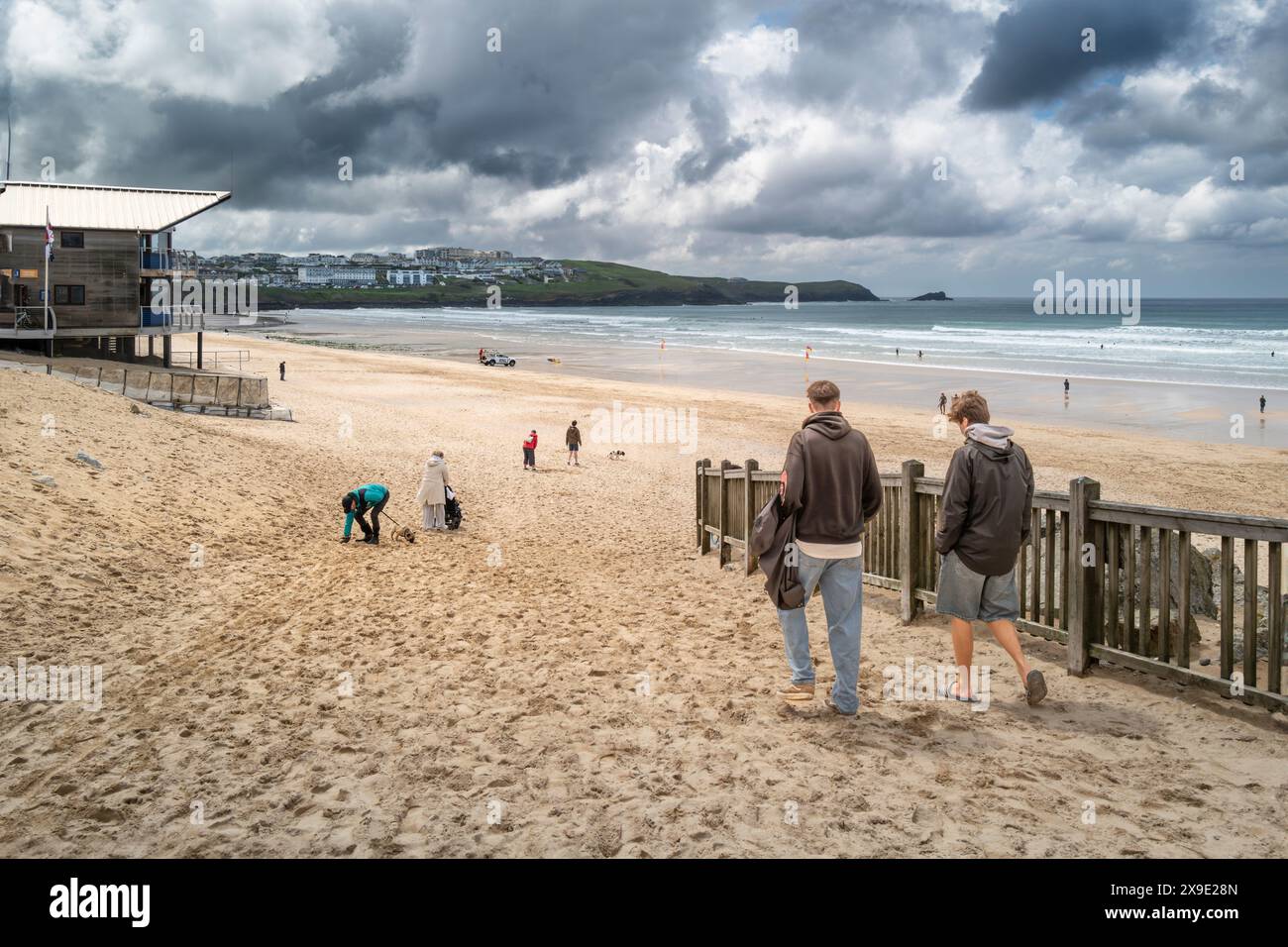 People visiting Fistral beach during the off season in Newquay in ...