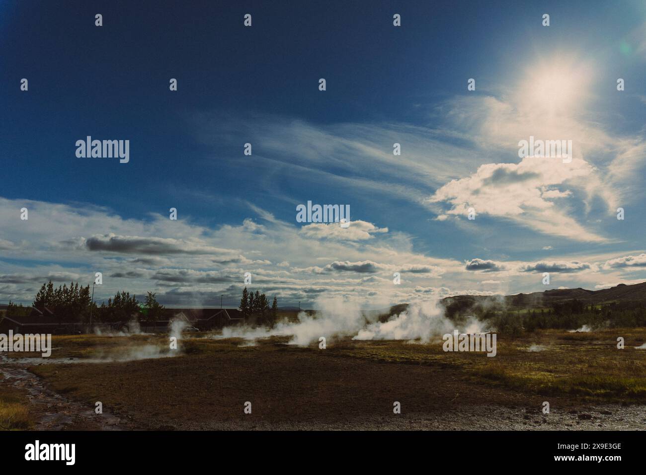 Geothermal hot spring at Iceland. Steam coming out from geyser Stock ...