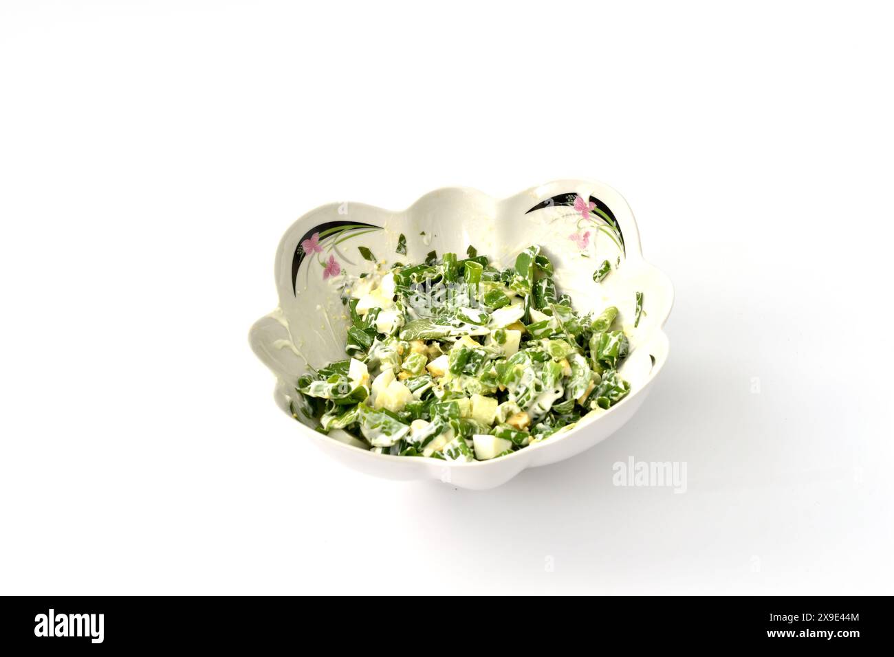 The picture shows a deep plate with freshly prepared salad Stock Photo ...