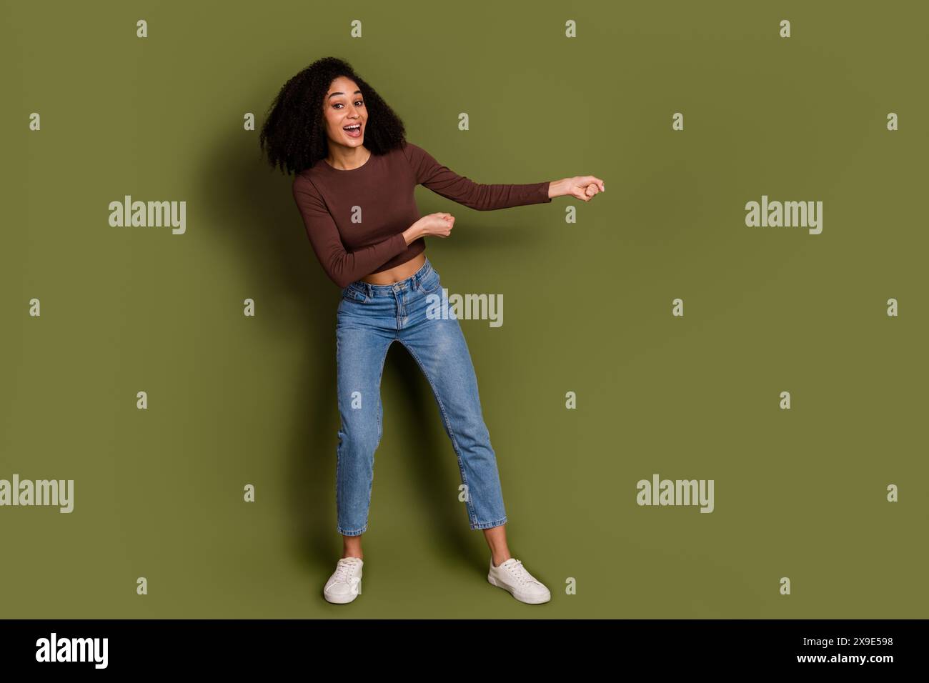 Full body photo of attractive young woman pull empty space dressed ...