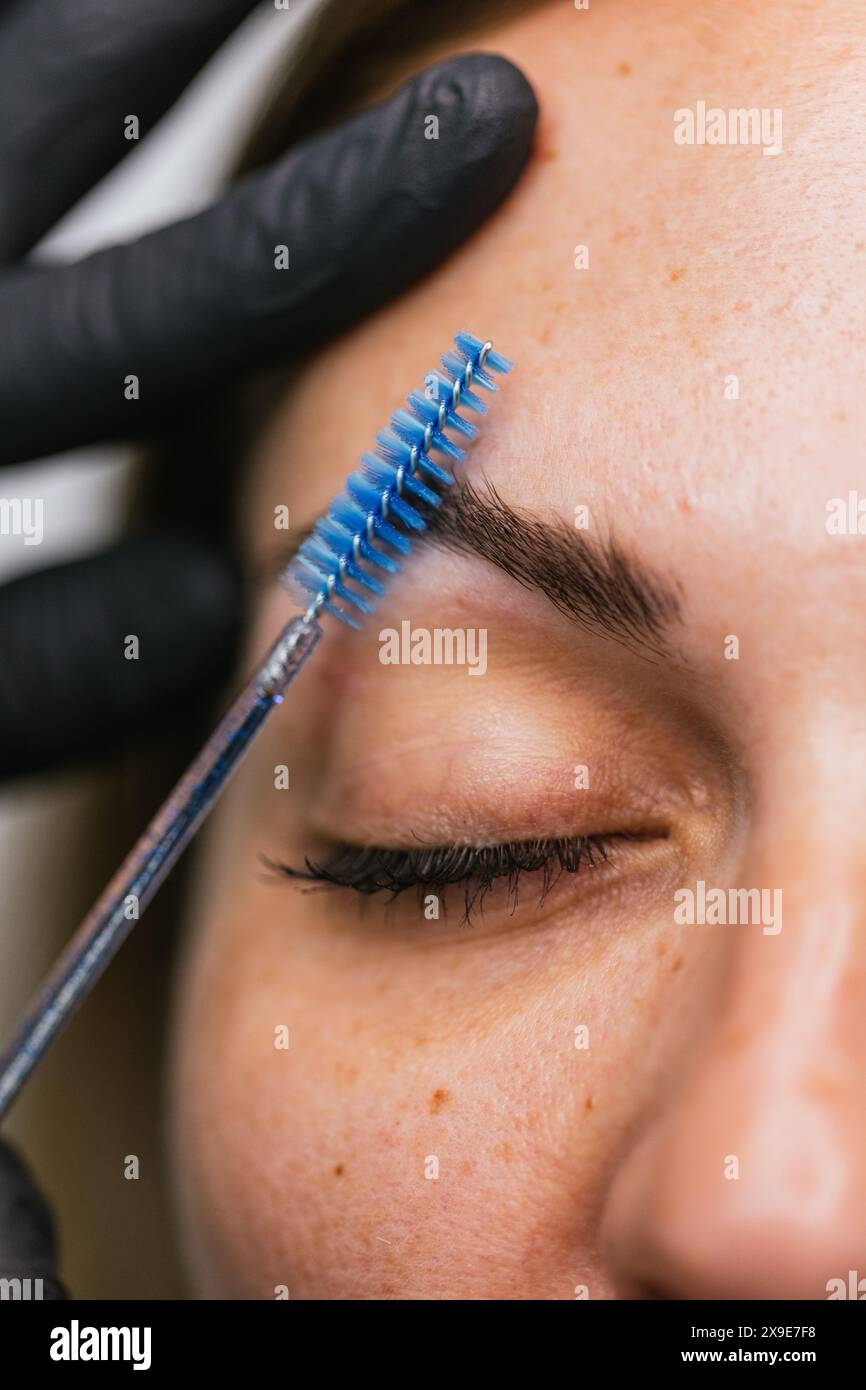 Close up eyebrow tattooing procedure hi-res stock photography and ...