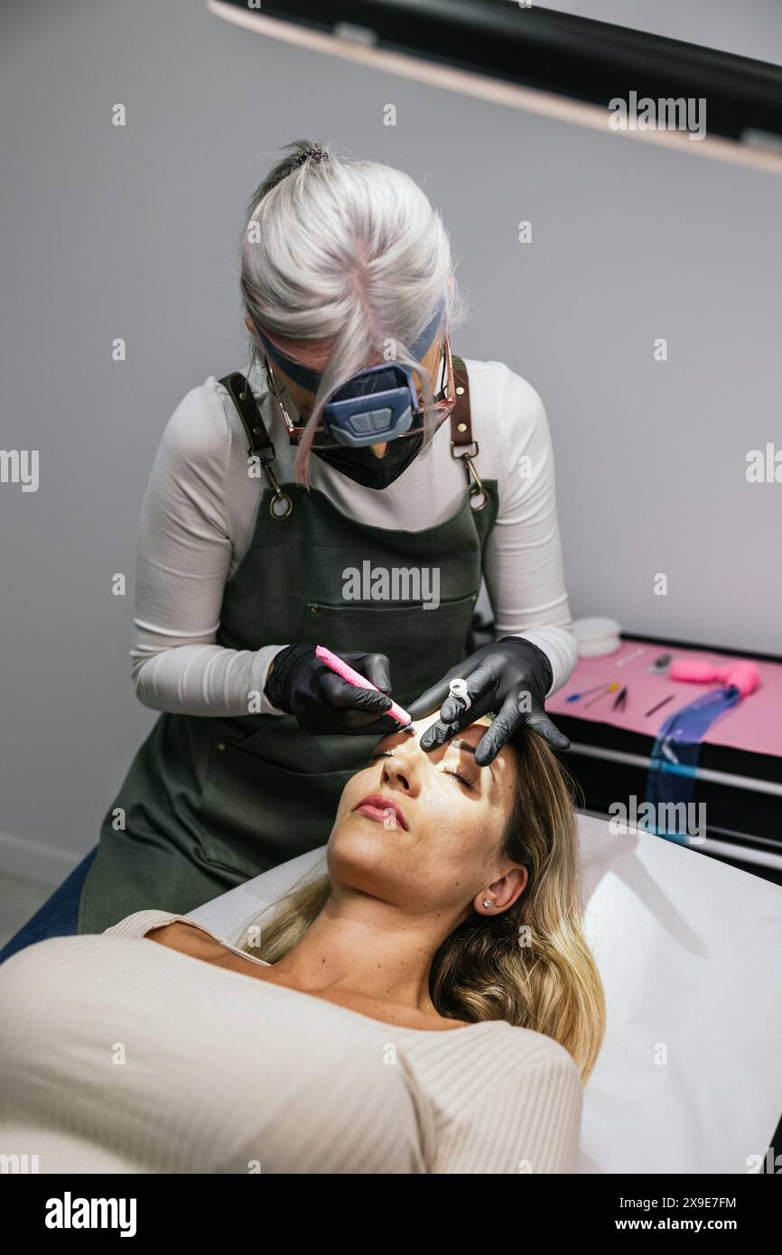 Professional microblading procedure in modern cosmetic studio Stock ...