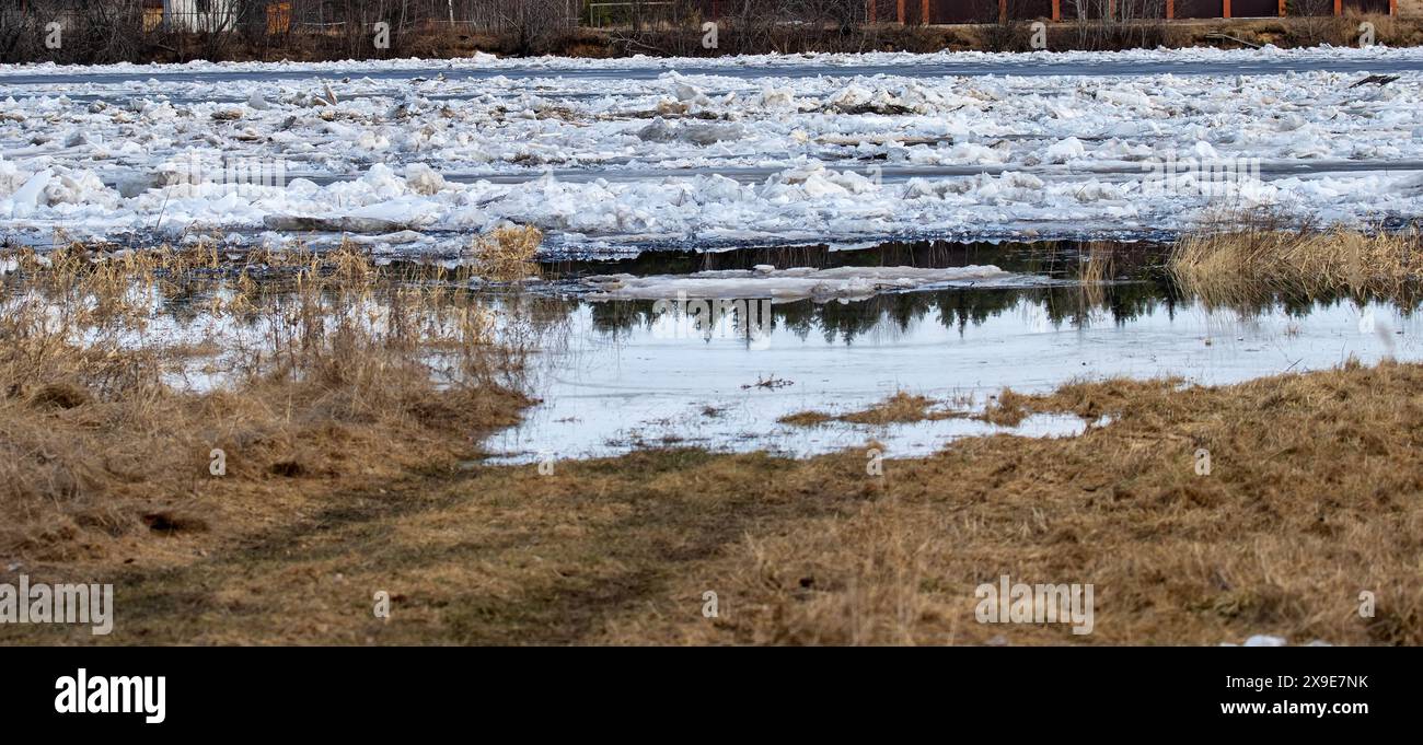 A landscape of an ice drift (ice-boom, debacle) on the northern river ...