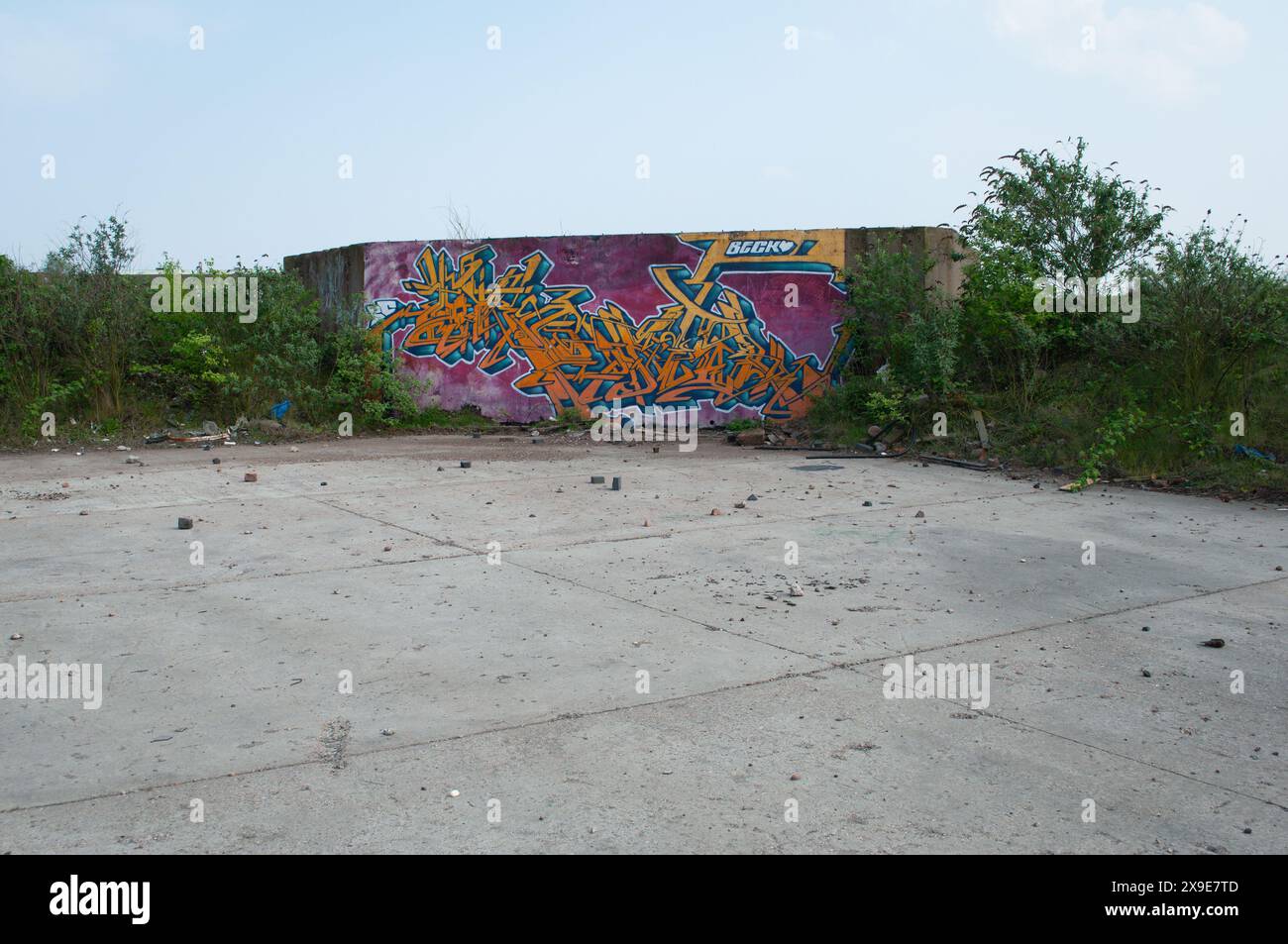 Concrete structure decorated with graffiti on heavily polluted site of ...