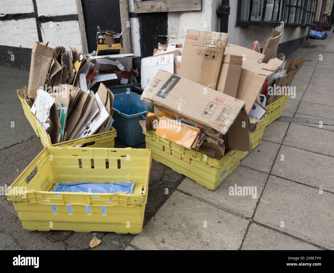 Packaging waste awaiting collection in town centre Stock Photo - Alamy