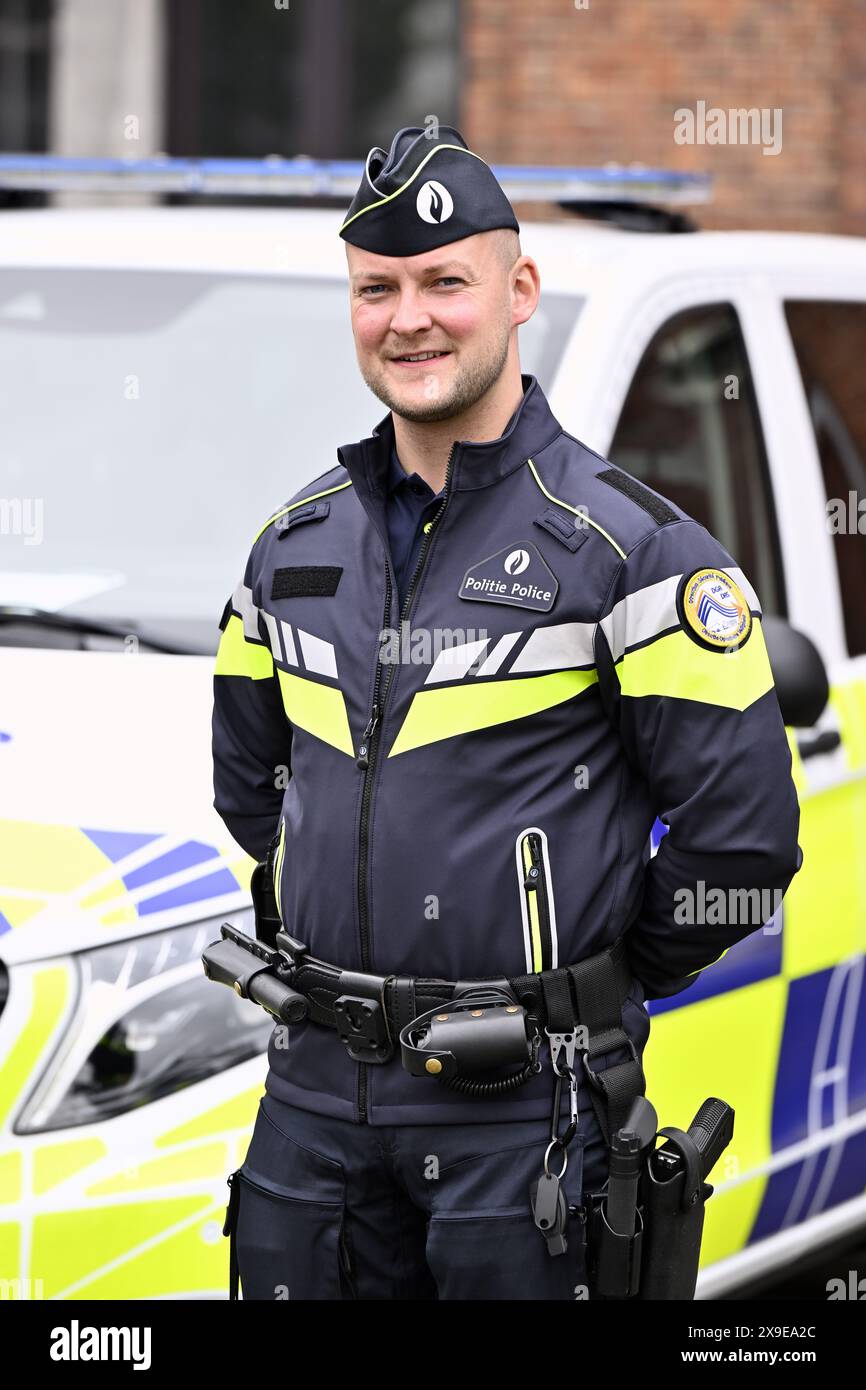 Brussels, Belgium. 31st May, 2024. A male police officer wearing the ...