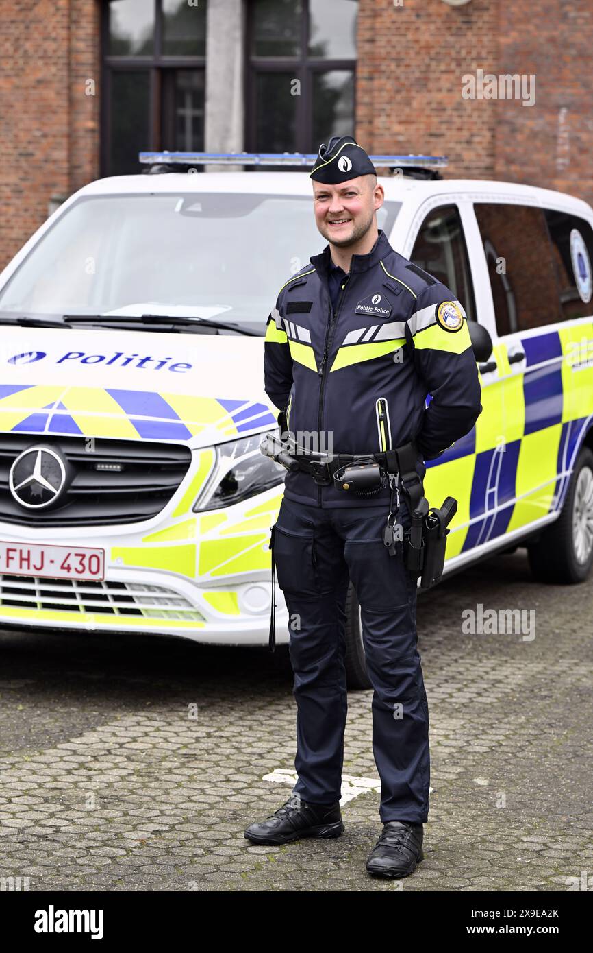 Brussels, Belgium. 31st May, 2024. A male police officer wearing the ...