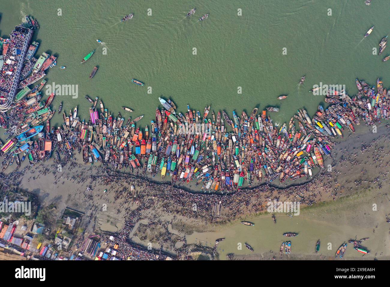 Devotees crowd small boats as they journey to attend the 'Chormonai ...
