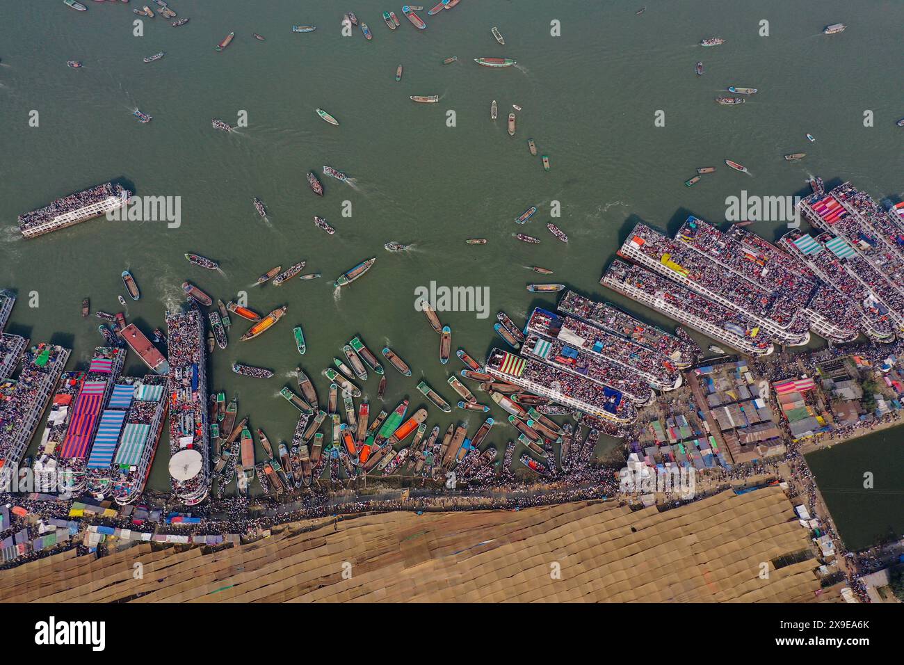 Devotees crowd the rooftops of vessels as they journey to attend the ...