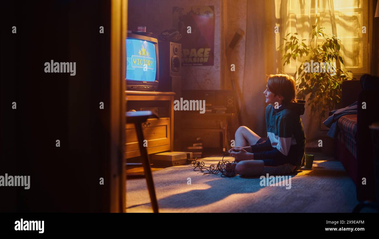 Young Boy Playing Eighties Eight Bit Arcade Video Game on a Console at ...