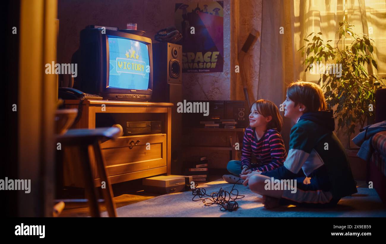 Nostalgic Happy Childhood Concept: Young Brother and Sister Playing Old ...