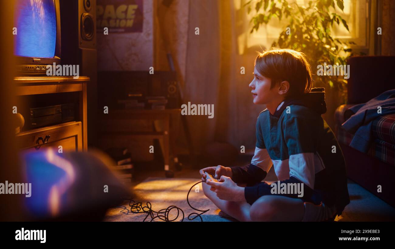 Young Boy Playing Eighties 2D Arcade Space Shooter Video Game on a ...