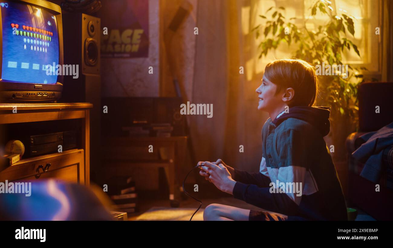 Young Boy Playing Eighties 2D Arcade Space Shooter Video Game on a ...
