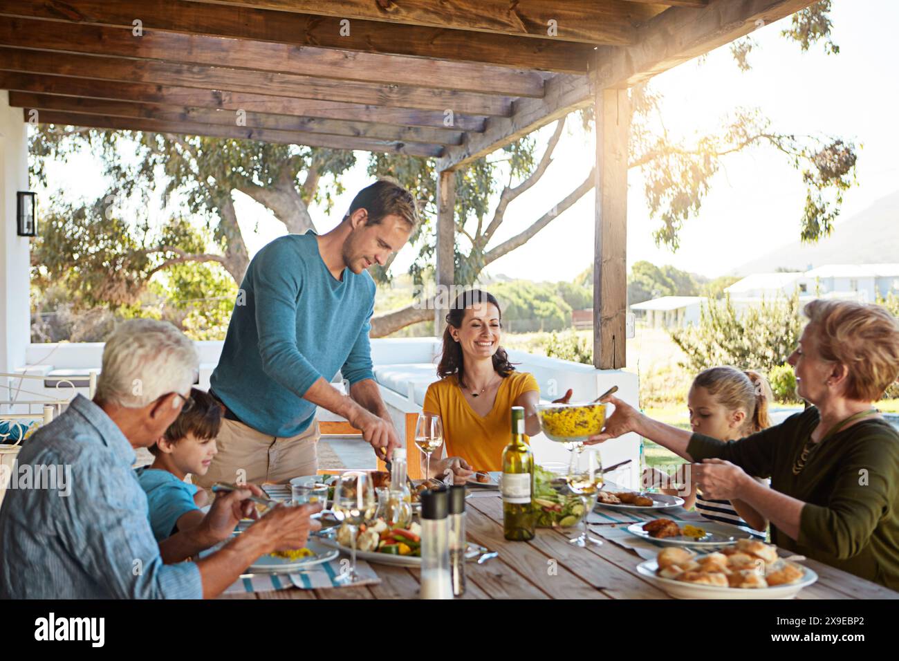 Big family, eating and lunch with food outdoor on patio with ...