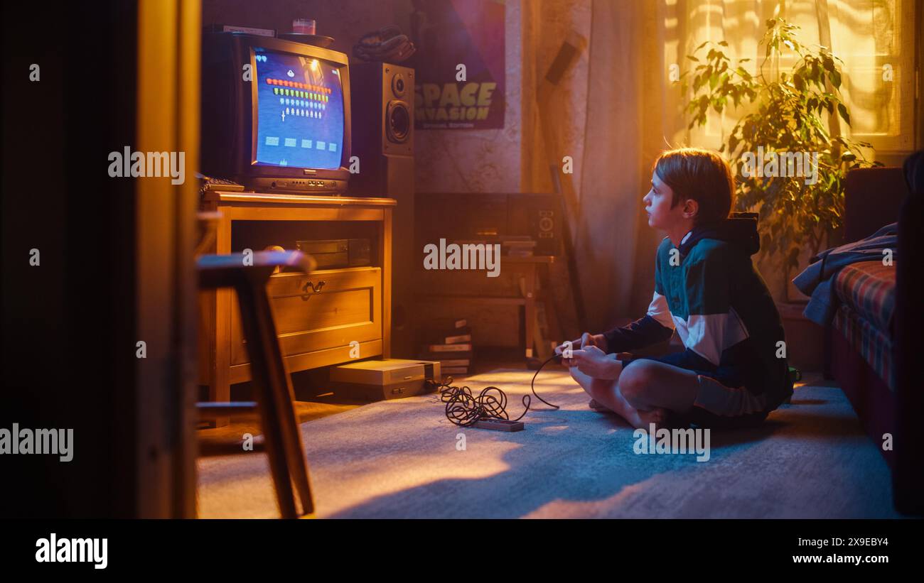 Handsome Child Playing 2D Arcade Space Shooter Video Game on a Console ...