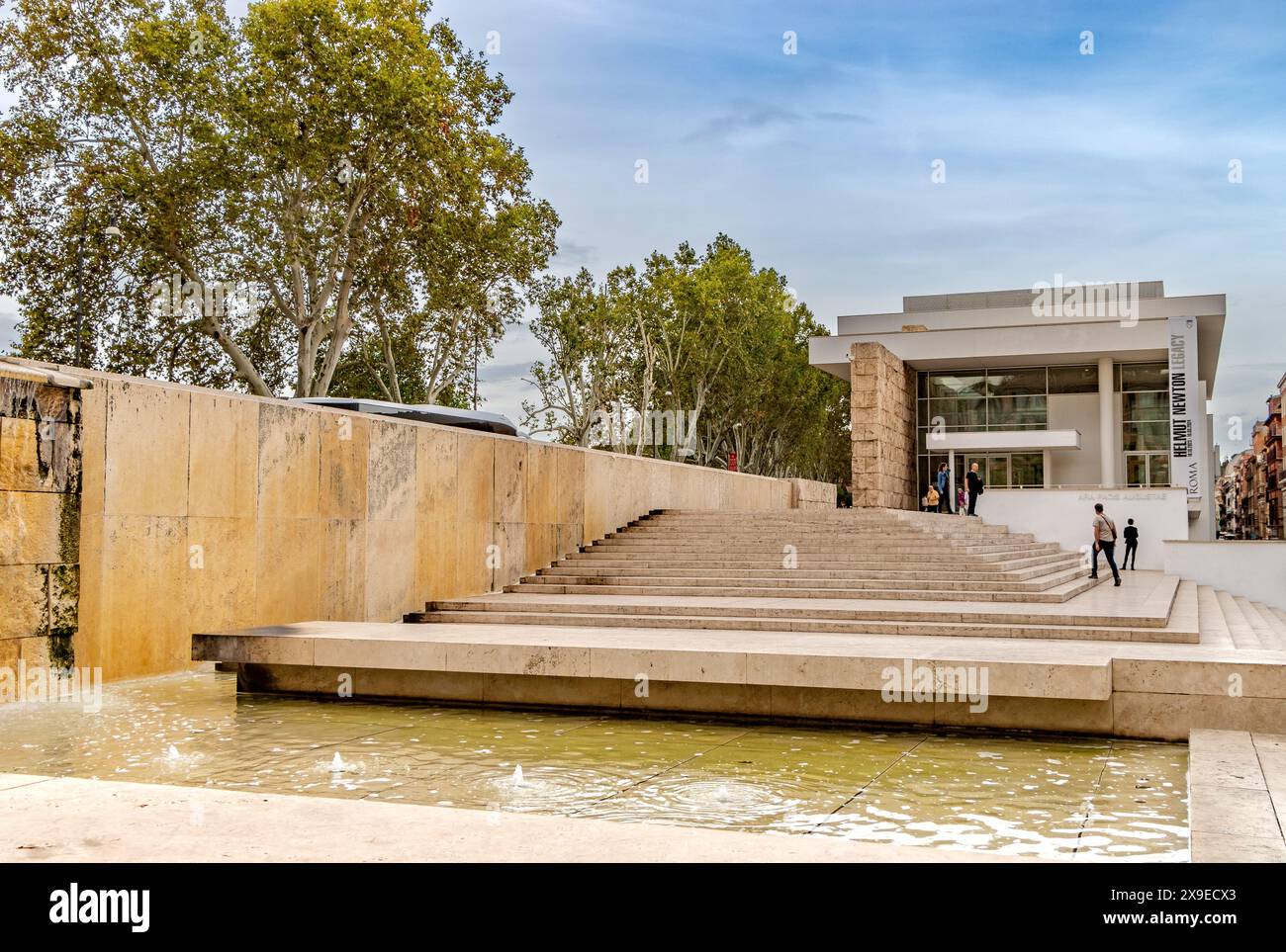 People sitting on the steps outside The Ara Pacis Museum in Rome a ...