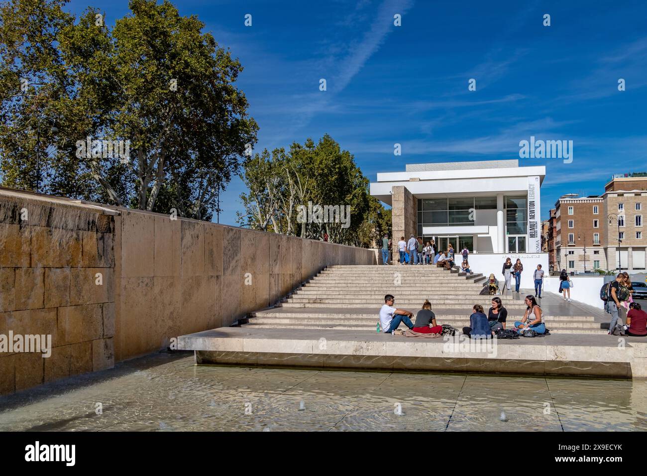 People sitting on the steps outside The Ara Pacis Museum in Rome a ...