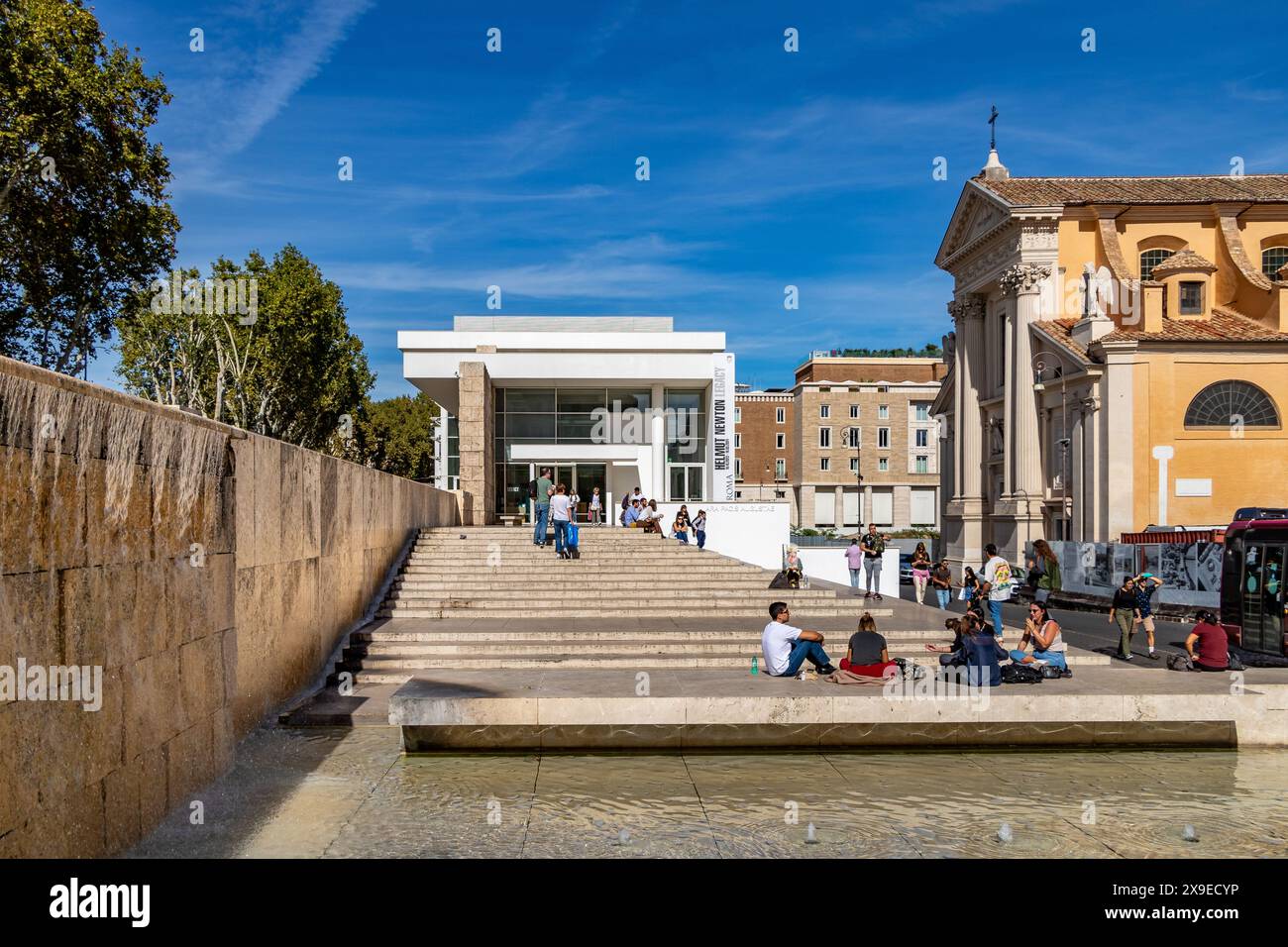 People sitting on the steps outside The Ara Pacis Museum in Rome a ...